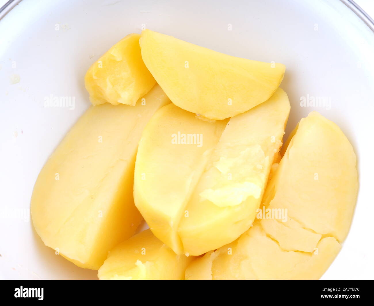 boiled potatoes on white background Stock Photo - Alamy
