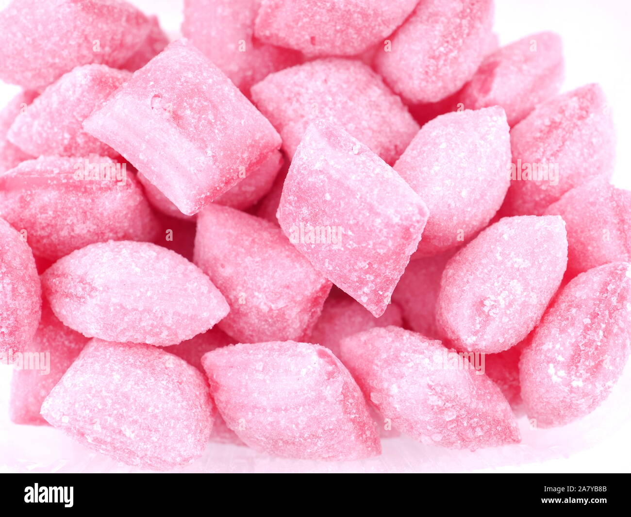 pink candy on a white background Stock Photo - Alamy