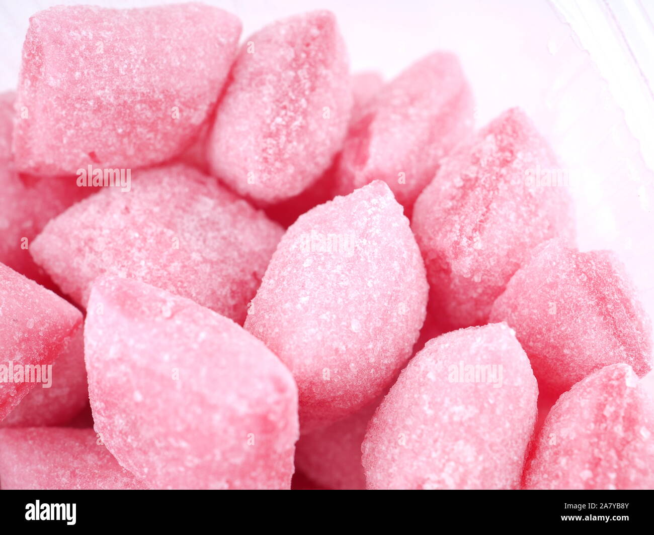 pink candy on a white background Stock Photo - Alamy
