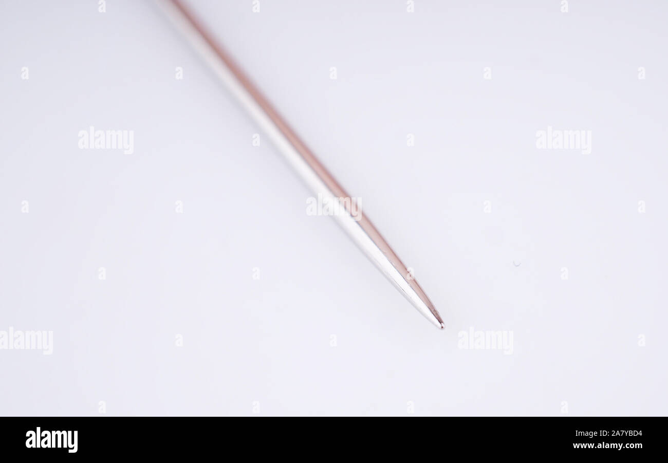 sewing needles on white background Stock Photo - Alamy