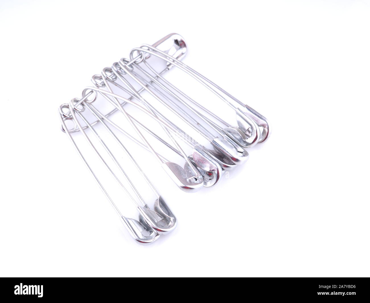 pins on white background Stock Photo - Alamy