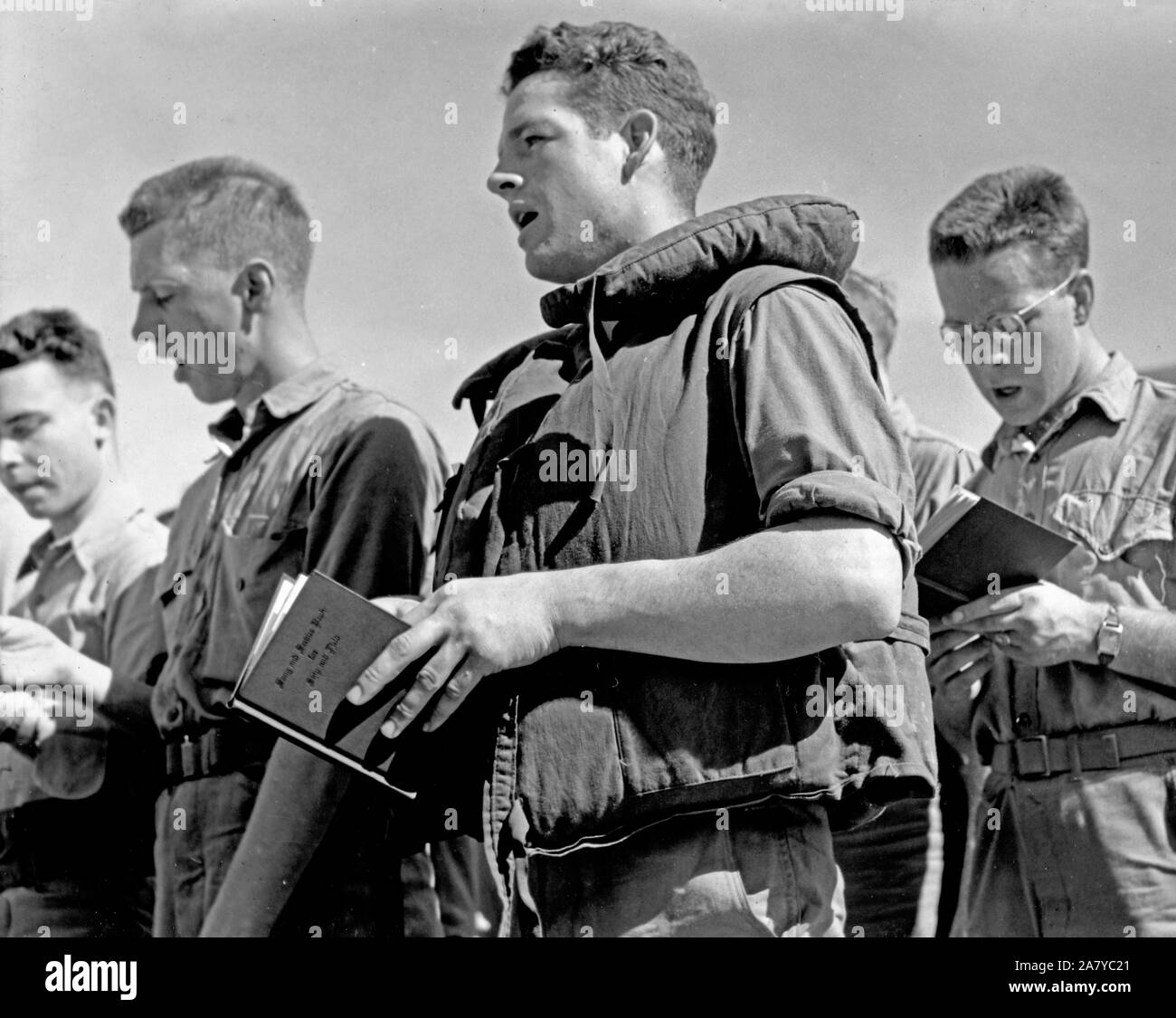A us marine sings songs aboard a transport in the south pacific wearing ...