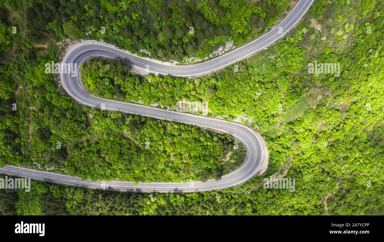 Aerial view of road through forest Stock Photo - Alamy