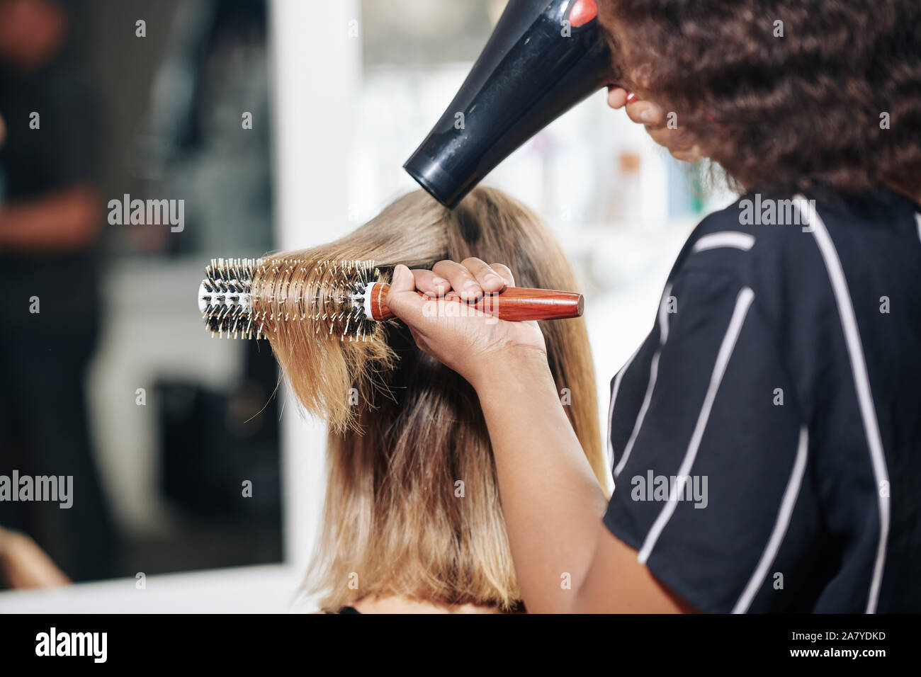 Brushing hair back hi-res stock photography and images - Alamy