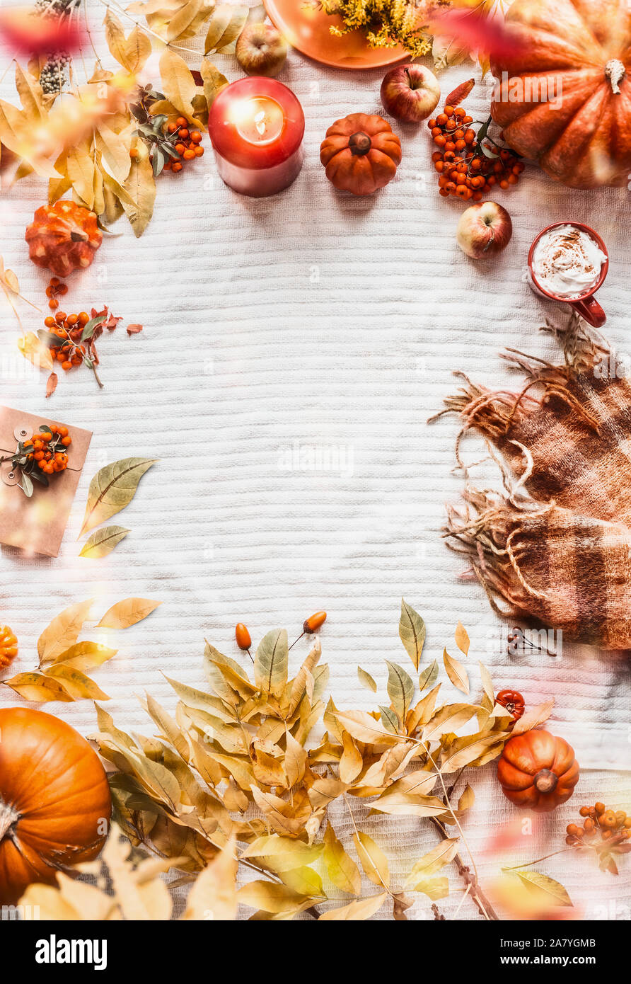 Vertical autumn background with yellow fall leaves, pumpkins, scarf ...