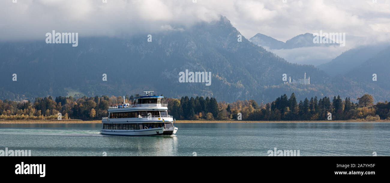 river boat on the lake Forggensee in autumn near Alps mountains Stock ...