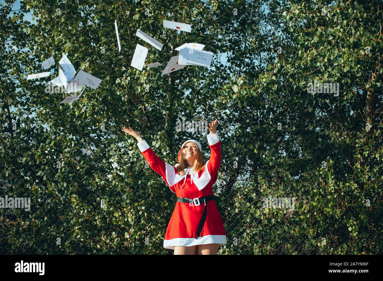 Female throwing cards hi-res stock photography and images - Alamy