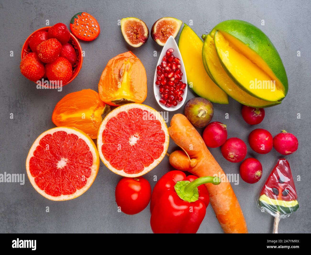 Close up of bright red, orange healthy fruits and vegetables products ...