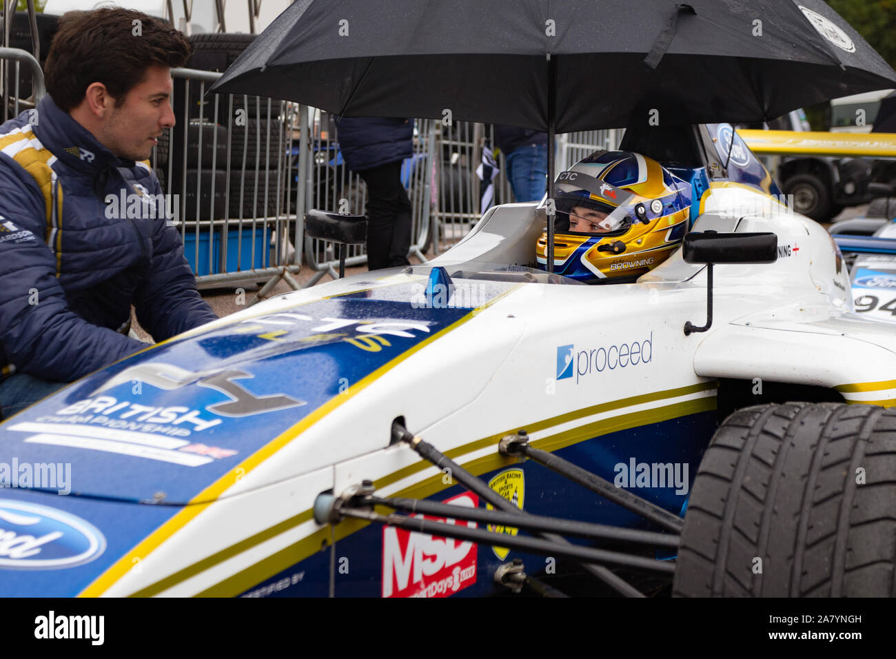 Luke Browning talks with team member before the first race of the day ...