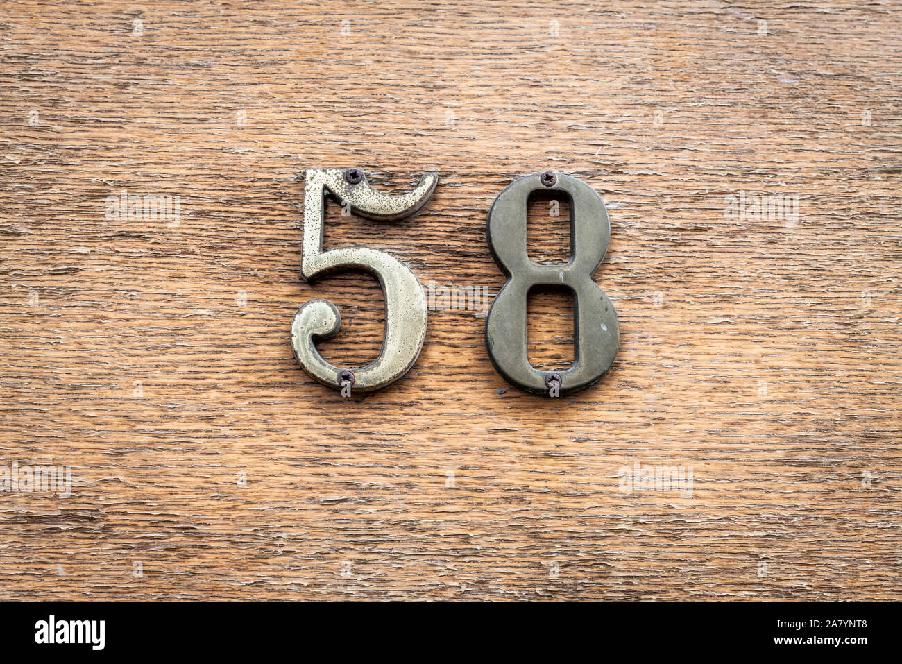 Street number sign on the wall Stock Photo - Alamy