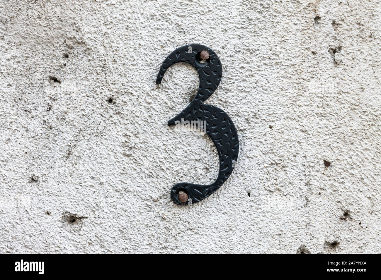 Street number sign on the wall Stock Photo - Alamy