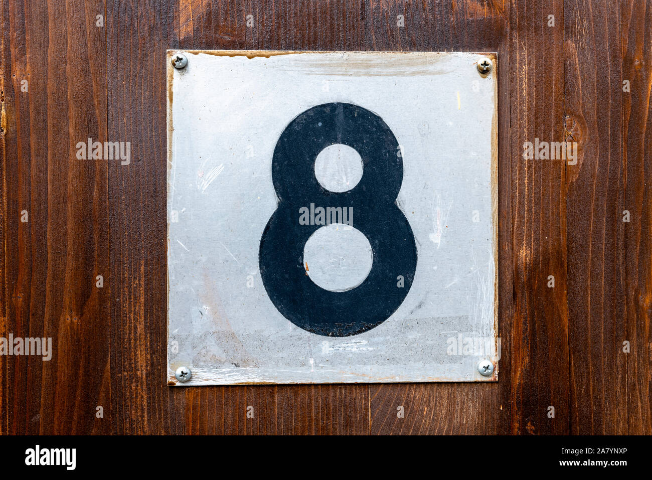Street number sign on the wall Stock Photo - Alamy