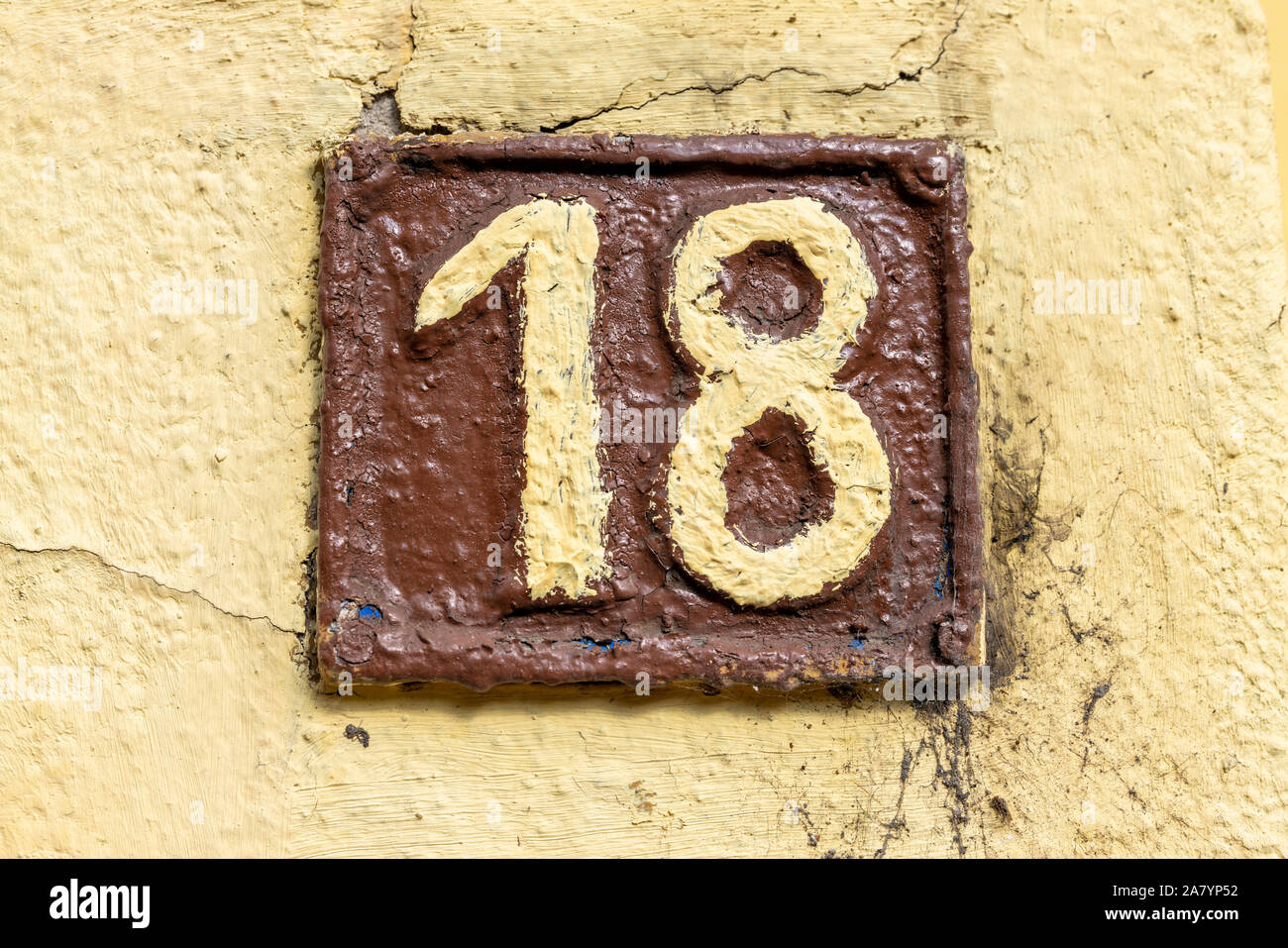 Street number sign on the wall Stock Photo - Alamy