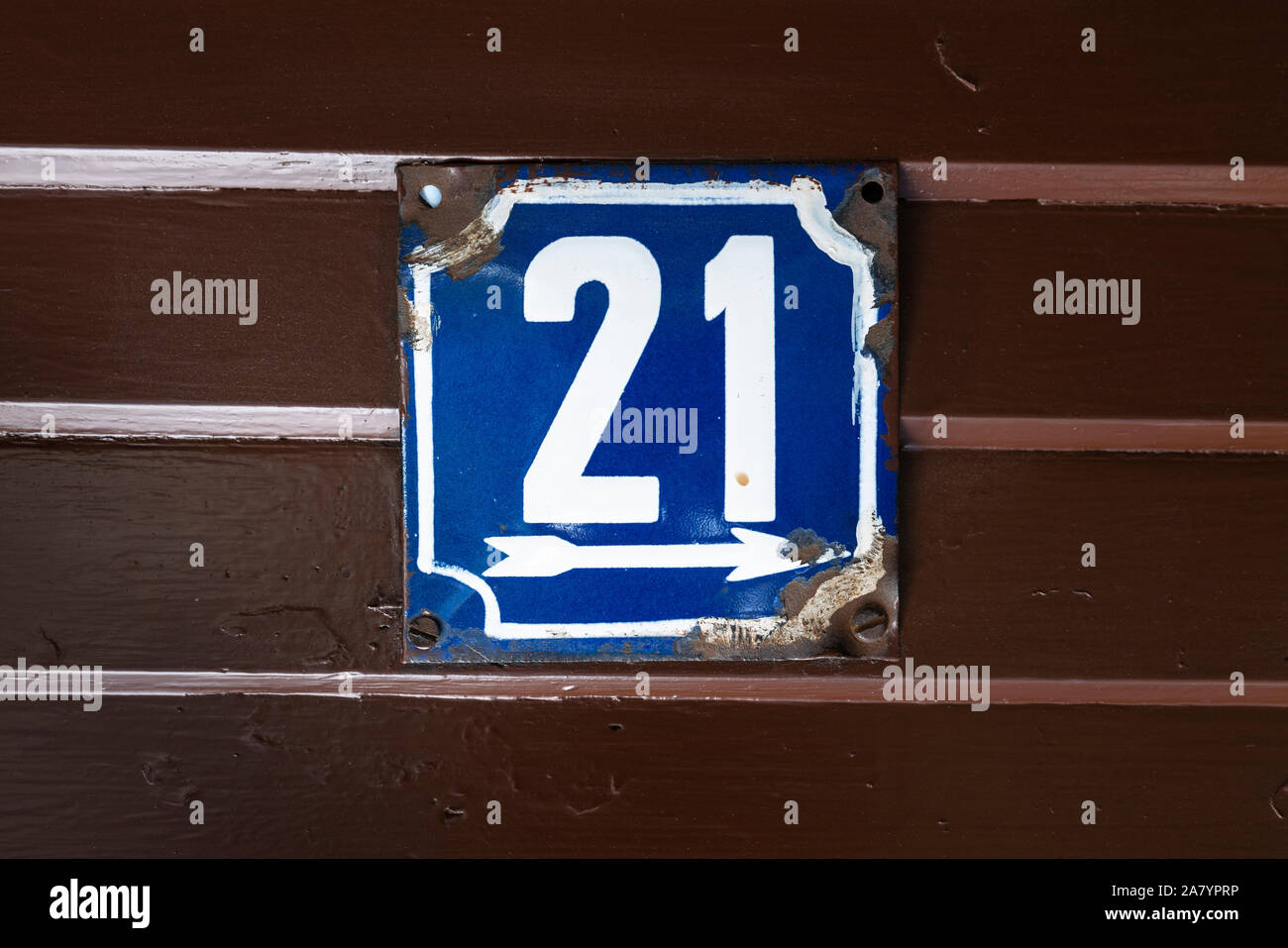 Street number sign on the wall Stock Photo - Alamy