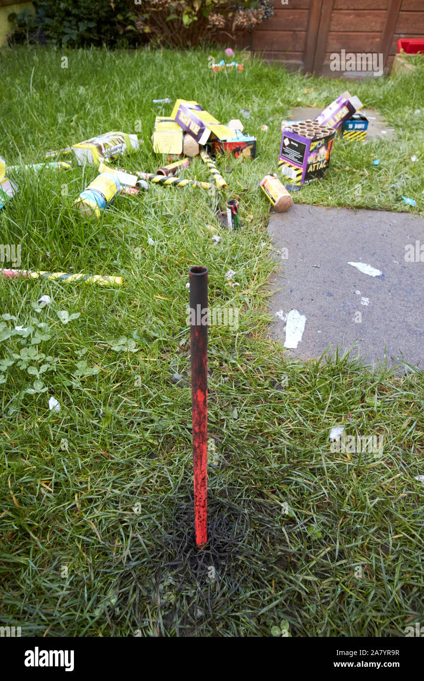 used rocket tube with burnt grass and fired fireworks litter after ...