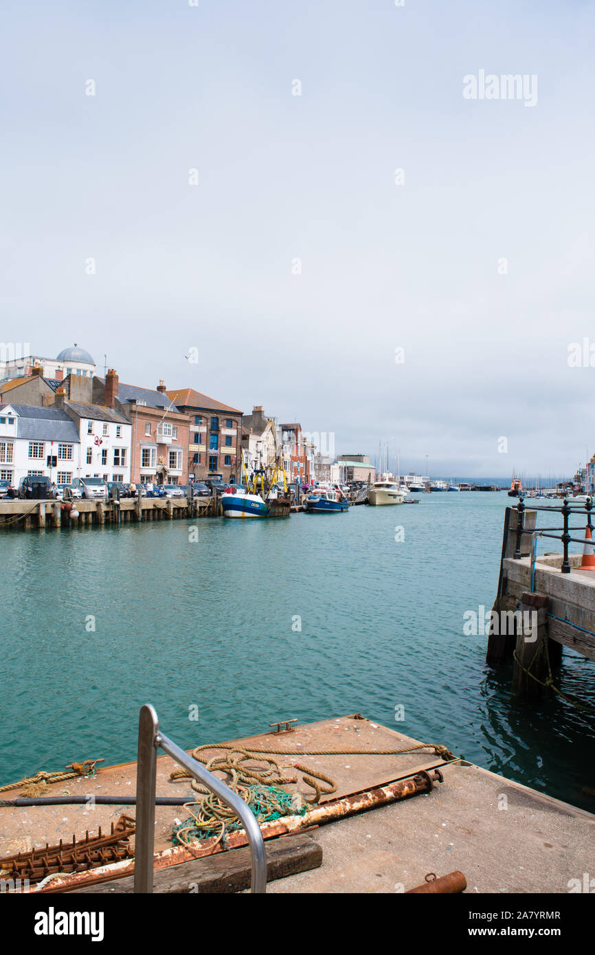 View from the historic old harbour in the popular seaside town of ...