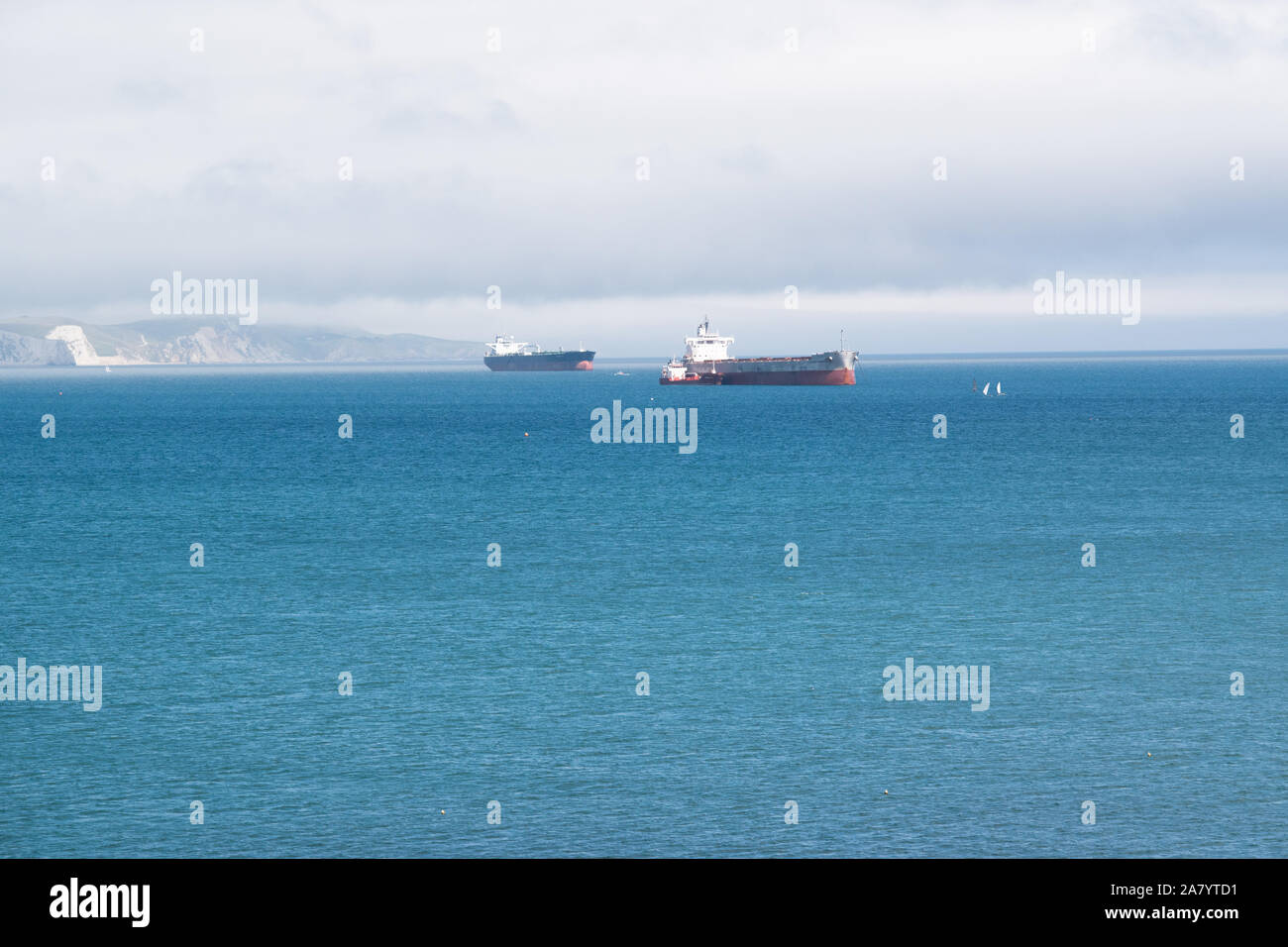 Large cargo carrying ships out at sea Stock Photo - Alamy