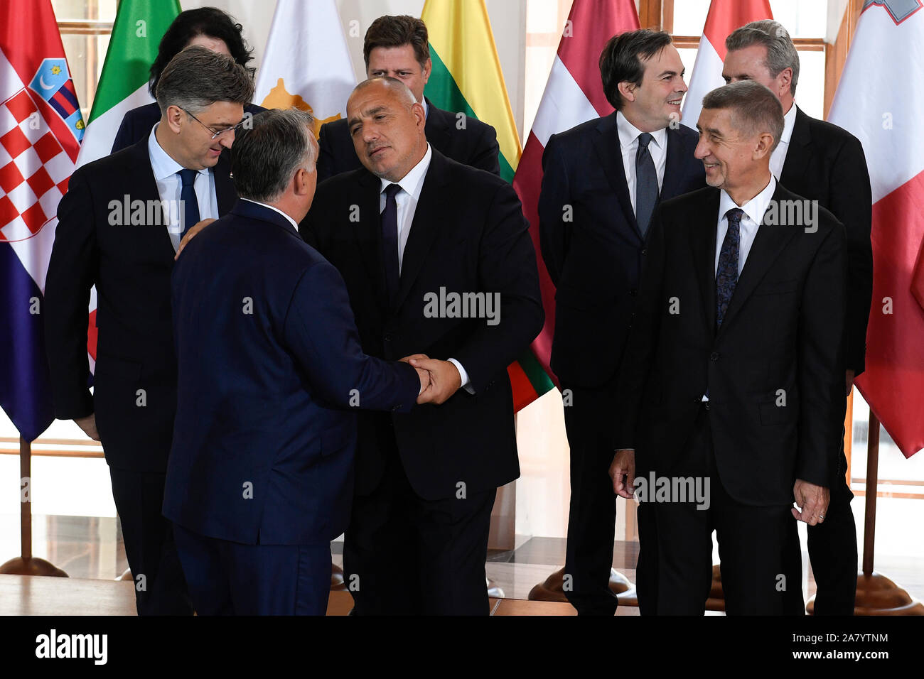 Hungarian Prime Minister Viktor Orban, second left, greets his ...
