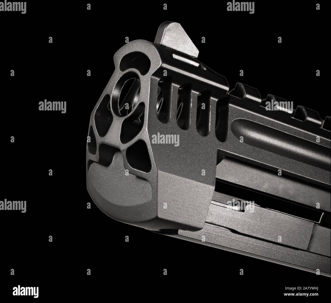 Ported handgun barrel that is on a black background Stock Photo - Alamy