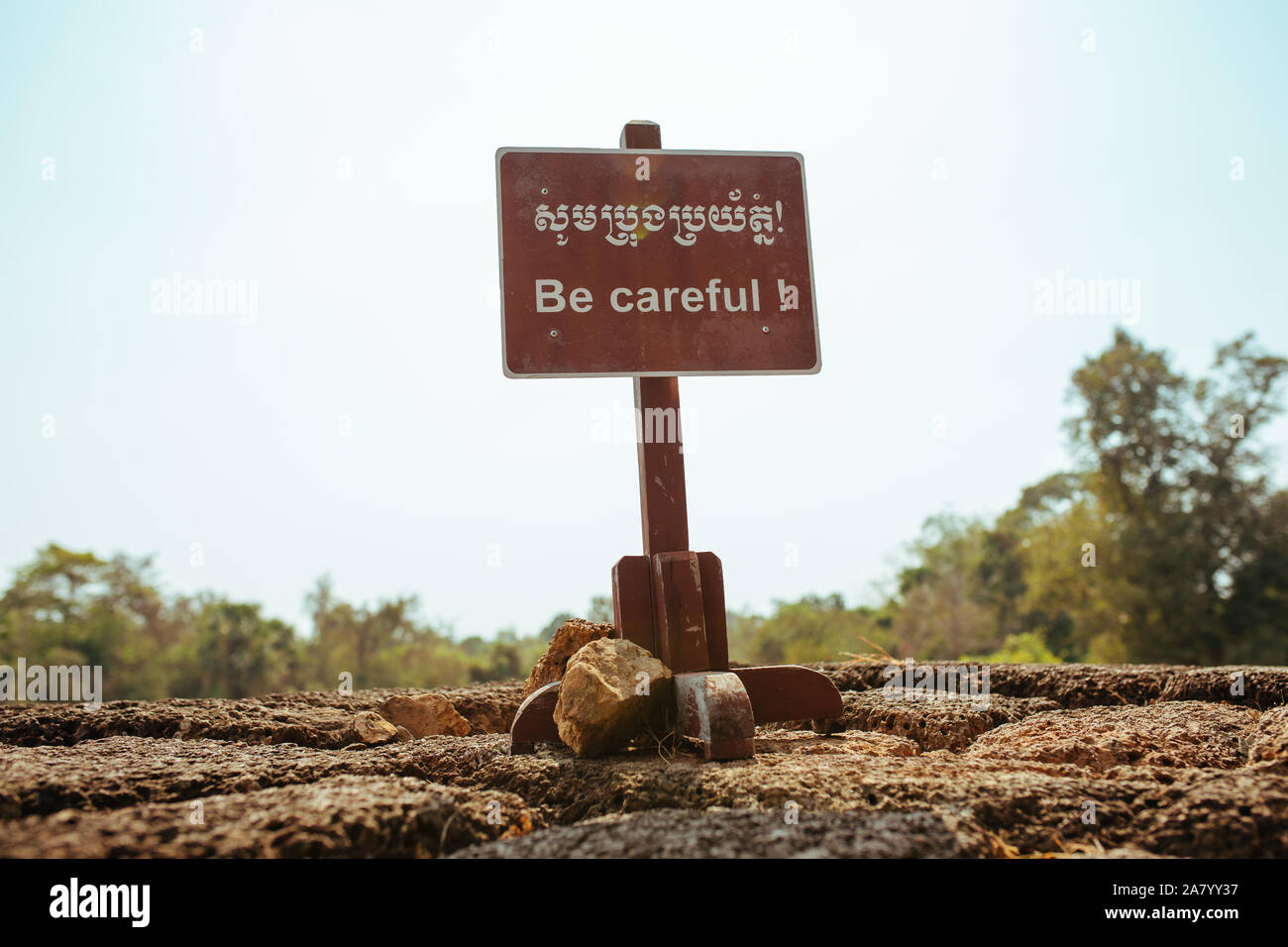 Be Careful Warning sign in Angkor Wat Temple Stock Photo - Alamy