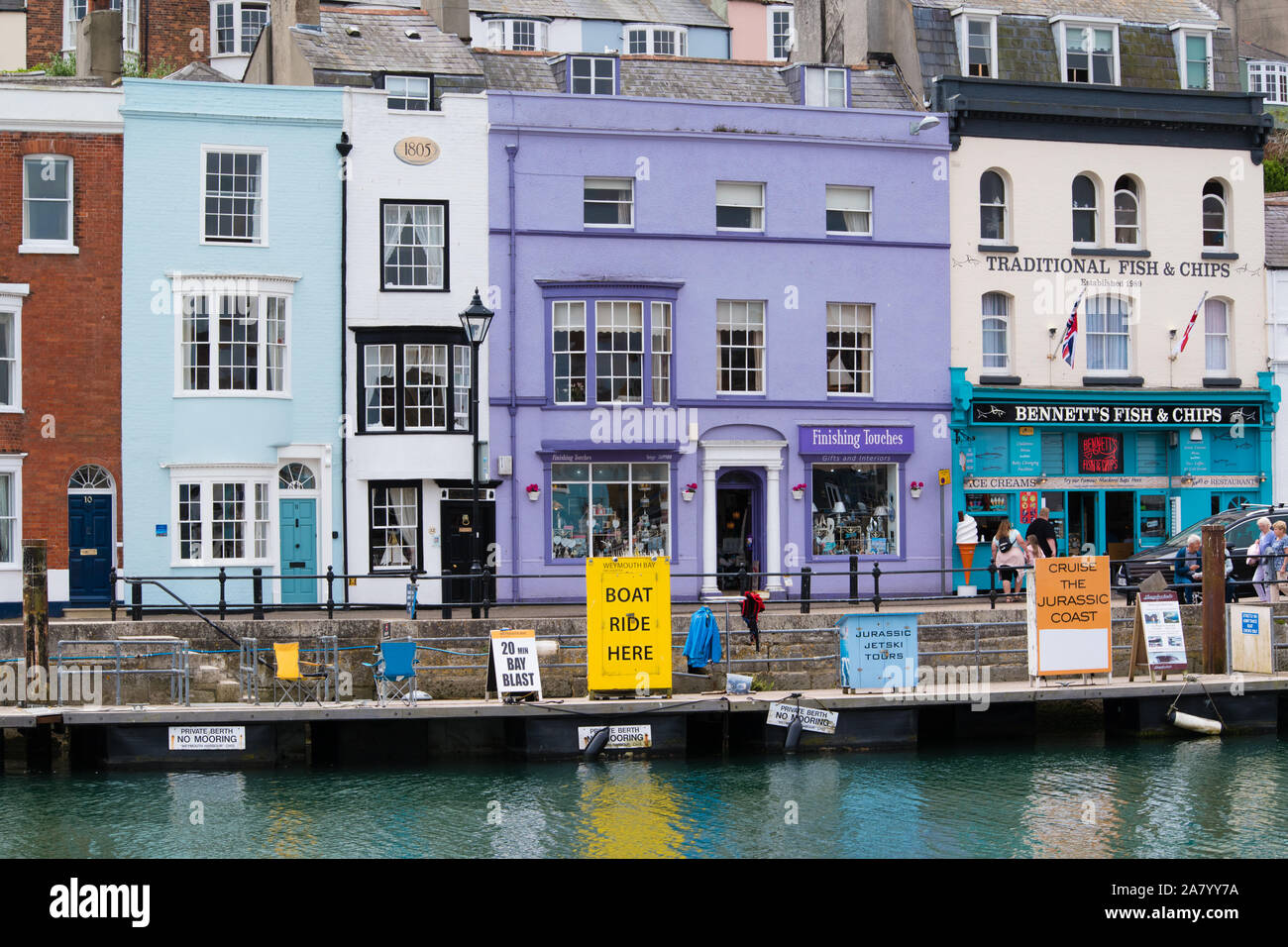view of the historic harbour front in the popular seaside town of ...