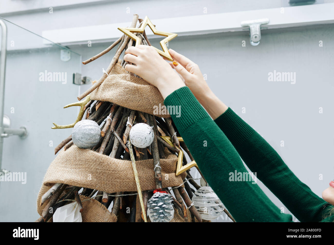 Putting star on christmas tree hi-res stock photography and images - Alamy