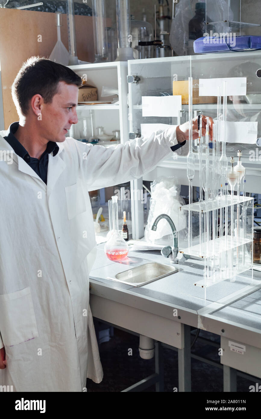 Female scientist conducts experiments in hi-res stock photography and ...