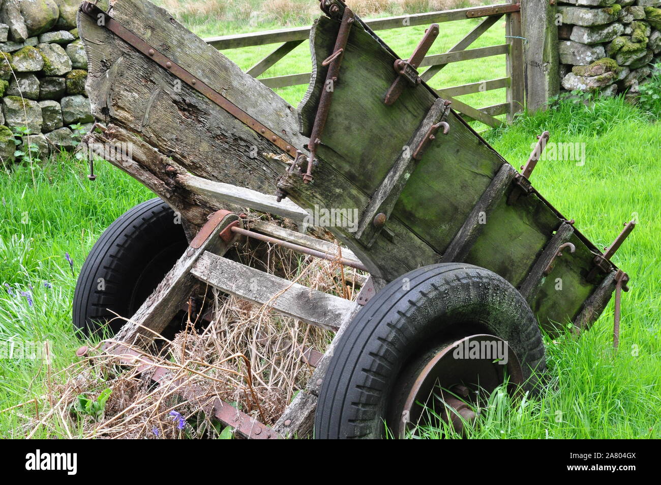 Abandoned farm cart in field Stock Photo - Alamy