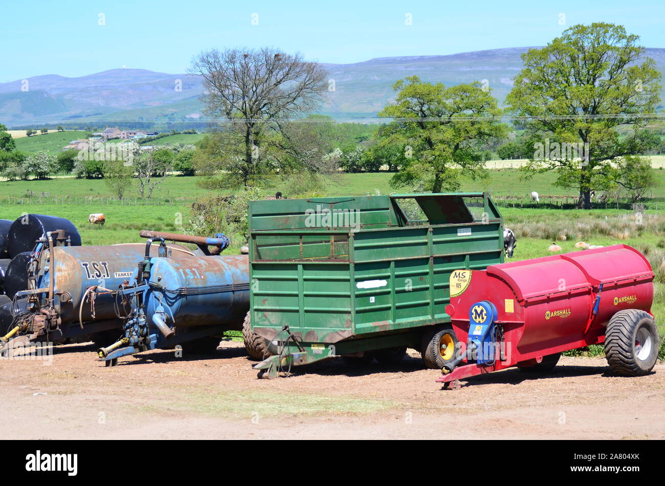 Farm machinery parked up in a farm yard Stock Photo - Alamy