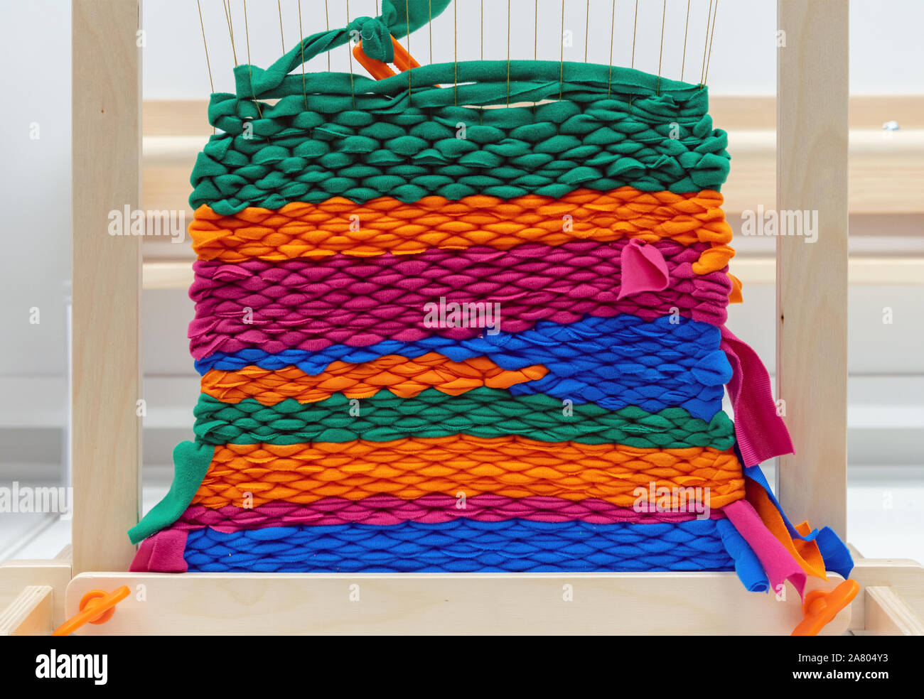 Children's loom for weaving rugs. Kid's creativity and needlework Stock ...