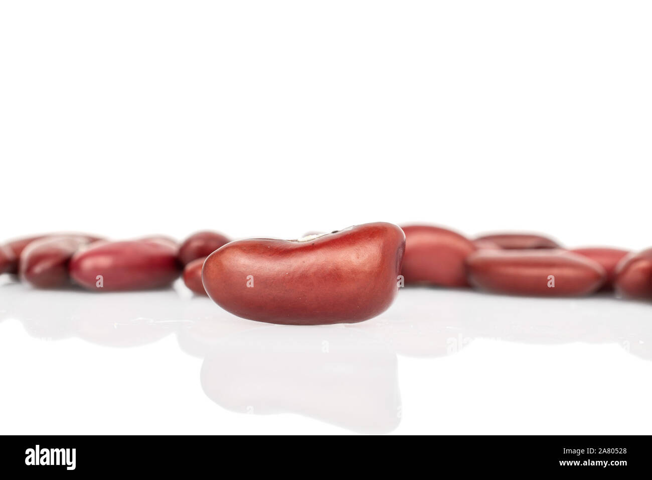 Lot of whole peeled fresh red kidney beans isolated on white background ...