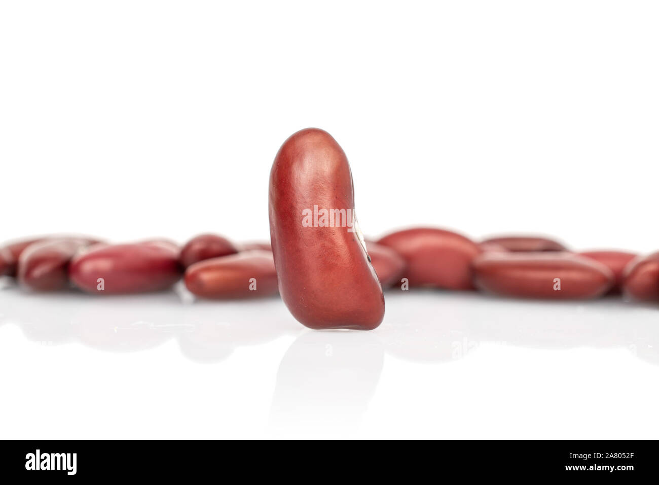 Lot of whole peeled fresh red kidney beans isolated on white background ...
