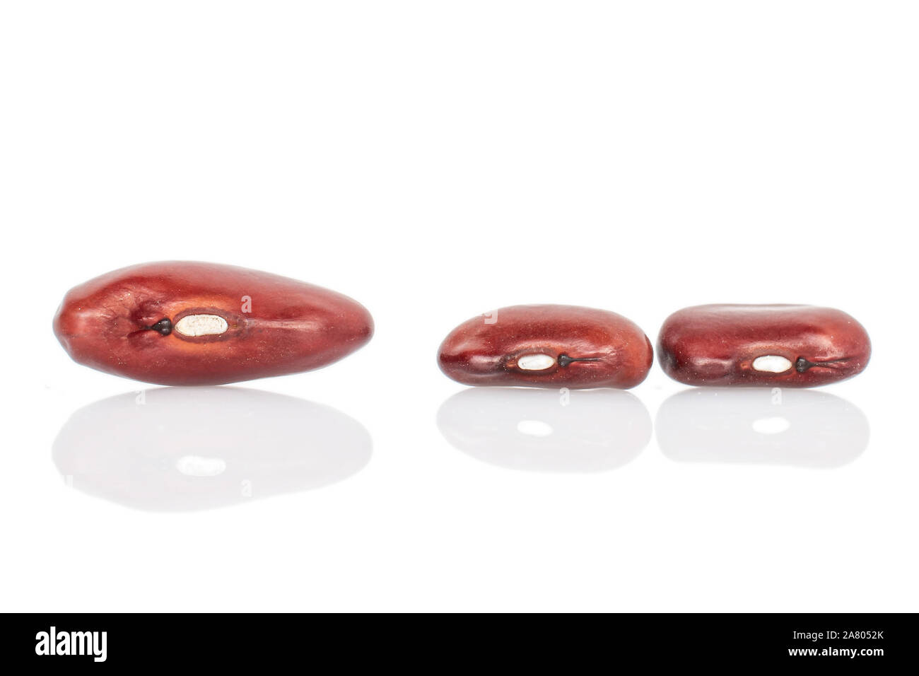 Group of three whole fresh red kidney beans isolated on white ...