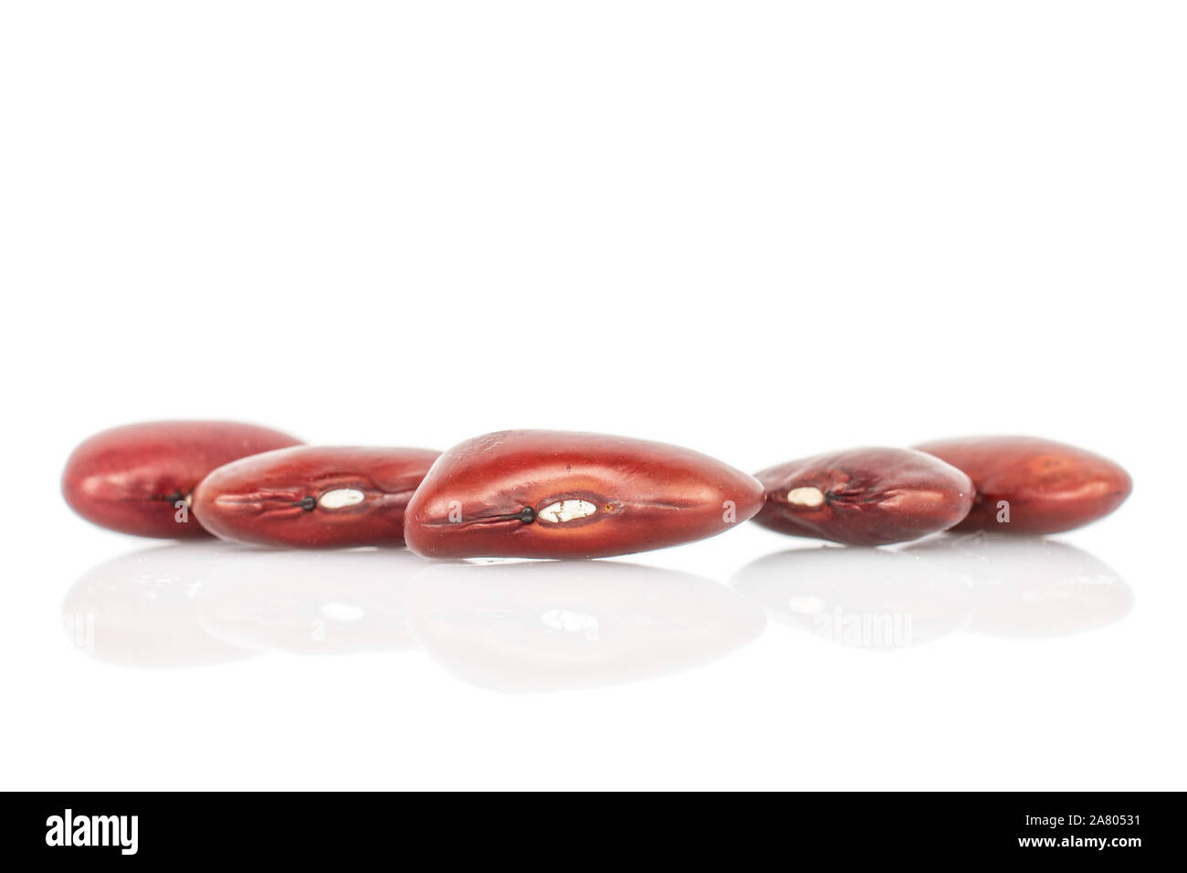 Group of five whole fresh red kidney beans isolated on white background ...