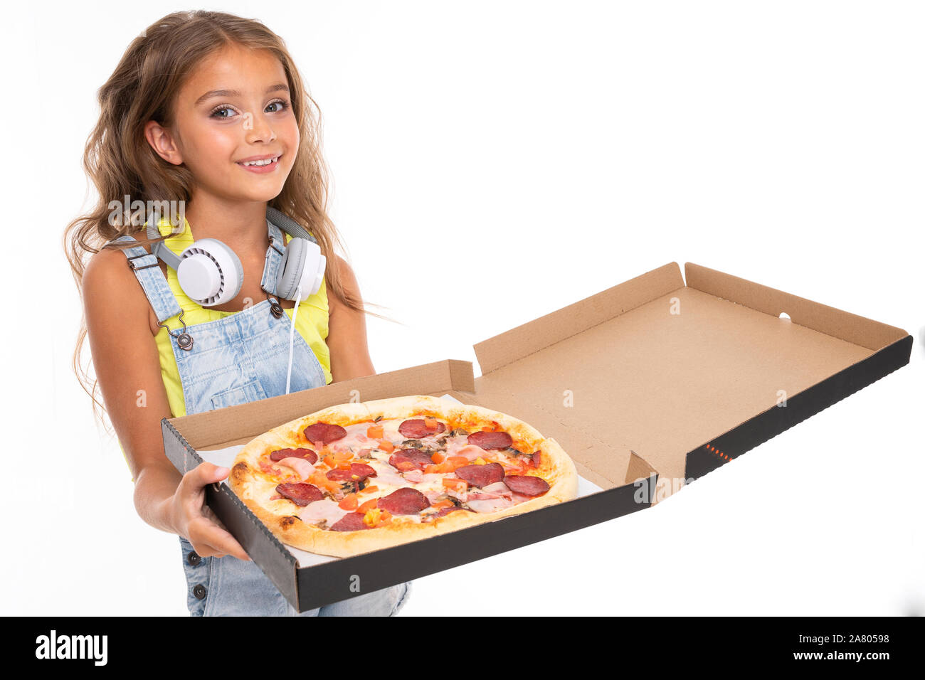 Little pretty caucasian girl with pizza Stock Photo - Alamy