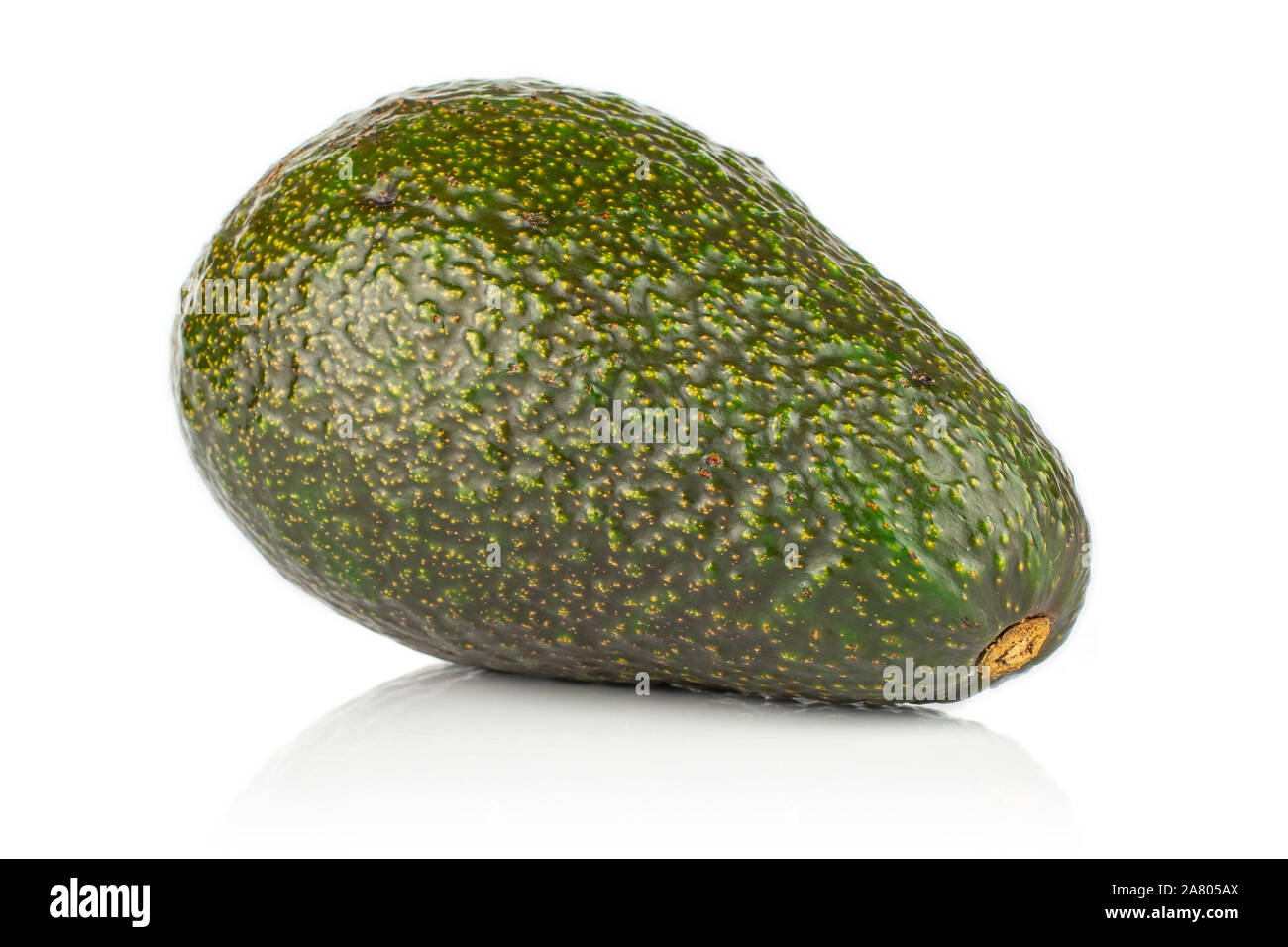 One whole fresh green avocado isolated on white background Stock Photo ...