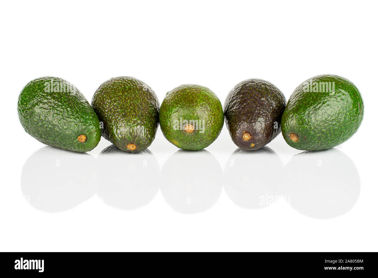 Group of five whole fresh green avocado isolated on white background ...