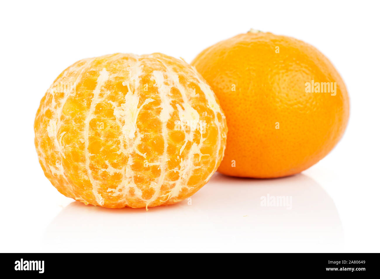 Group of two whole fresh orange mandarine isolated on white background ...