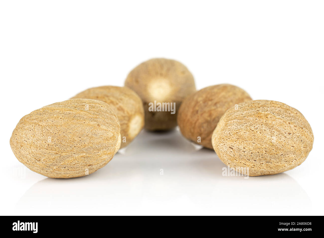 Group of five whole dry brown nutmeg isolated on white background Stock ...