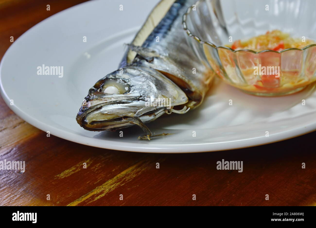 steamed Saba fish and spicy sauce on plate Stock Photo - Alamy
