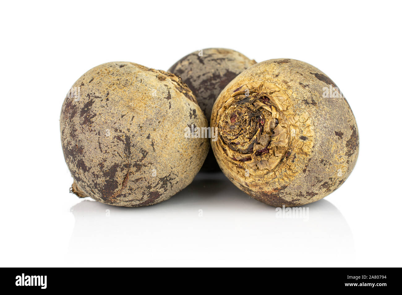 Group of three whole raw red beetroot isolated on white background ...