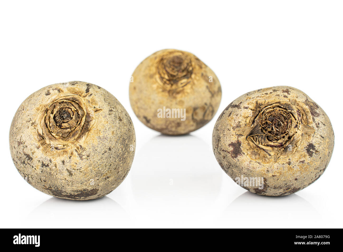 Group of three whole raw red beetroot isolated on white background ...