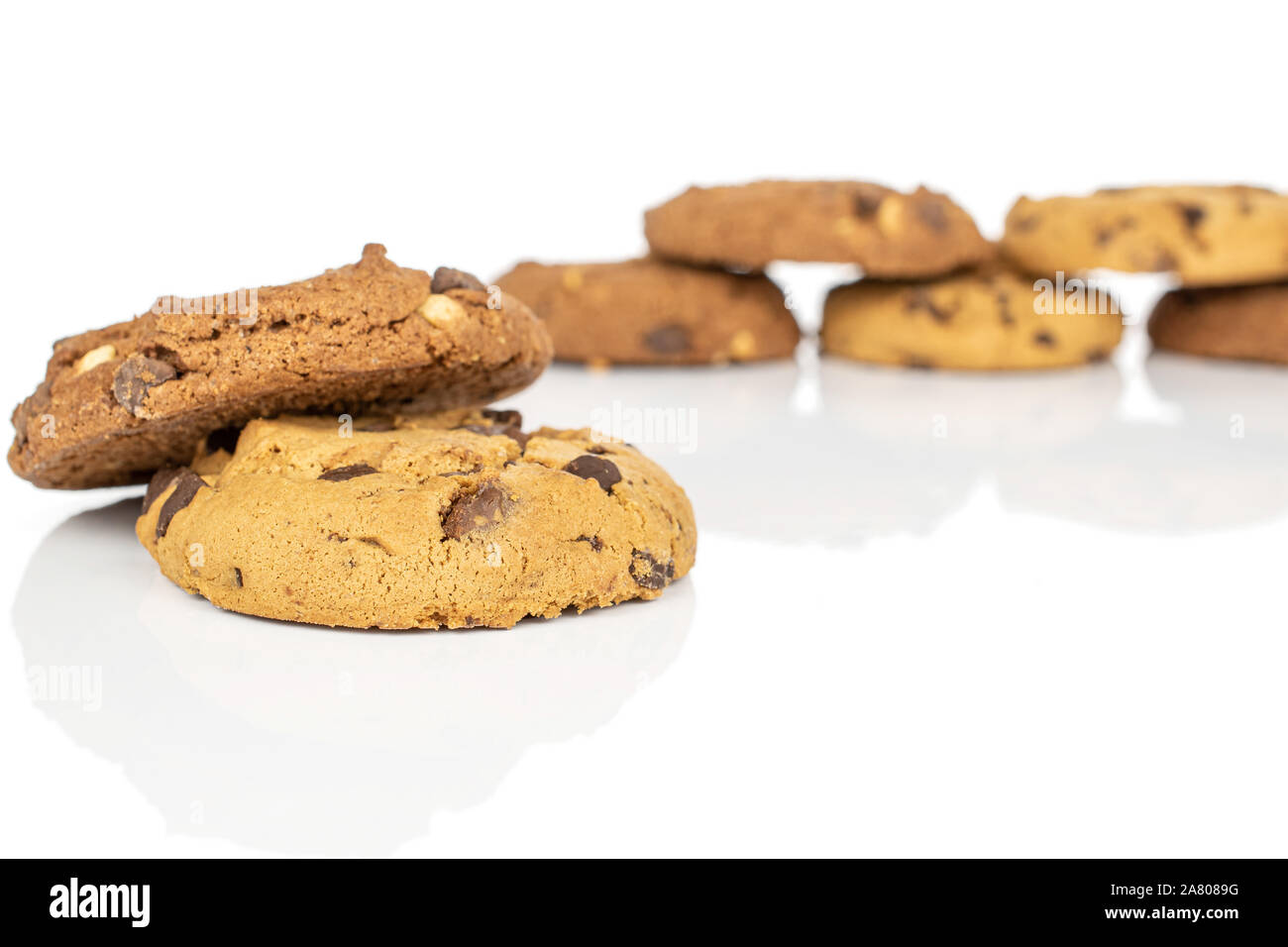 Group of seven whole sweet brown cookie isolated on white background ...