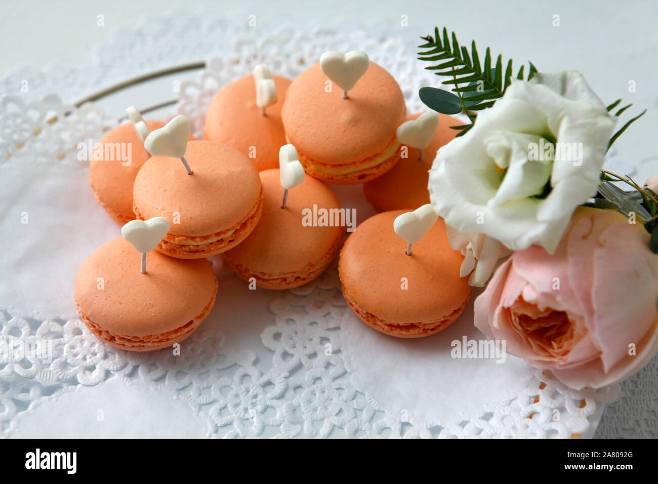 Cakes and boutonniere with roses Stock Photo - Alamy