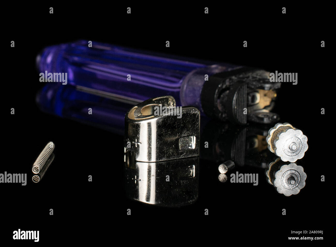 Group of one whole four pieces of plastic lighter isolated on black ...