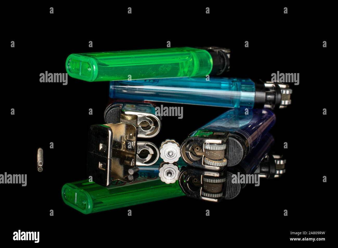 Group of four whole four pieces of plastic lighter isolated on black ...