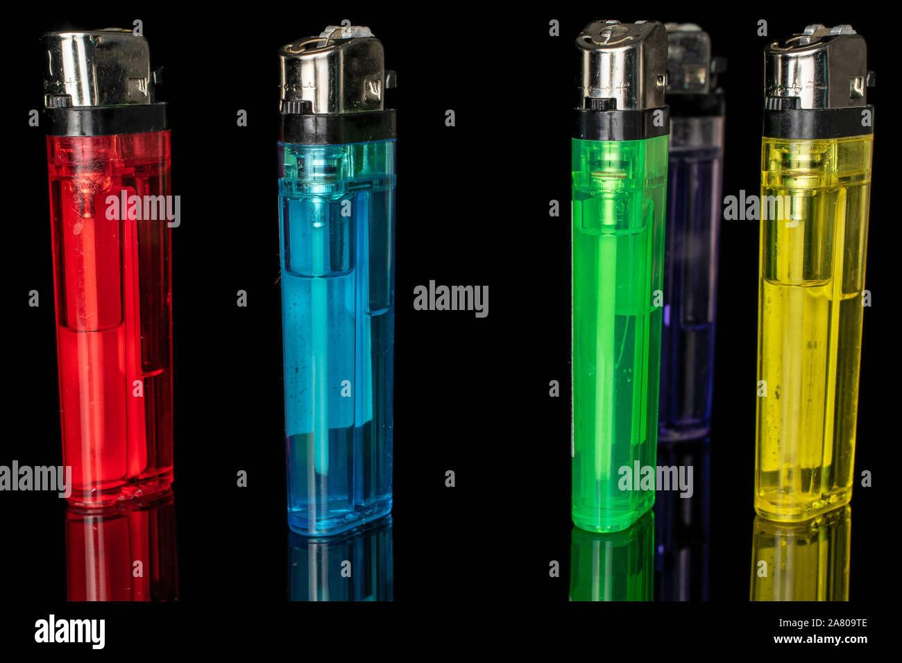 Group of five whole plastic lighter isolated on black glass Stock Photo ...