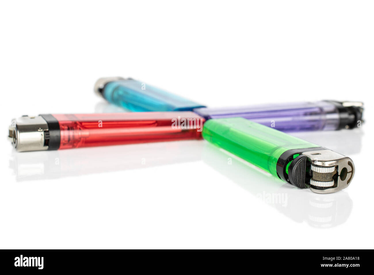 Group of four whole plastic lighter cross isolated on white background ...