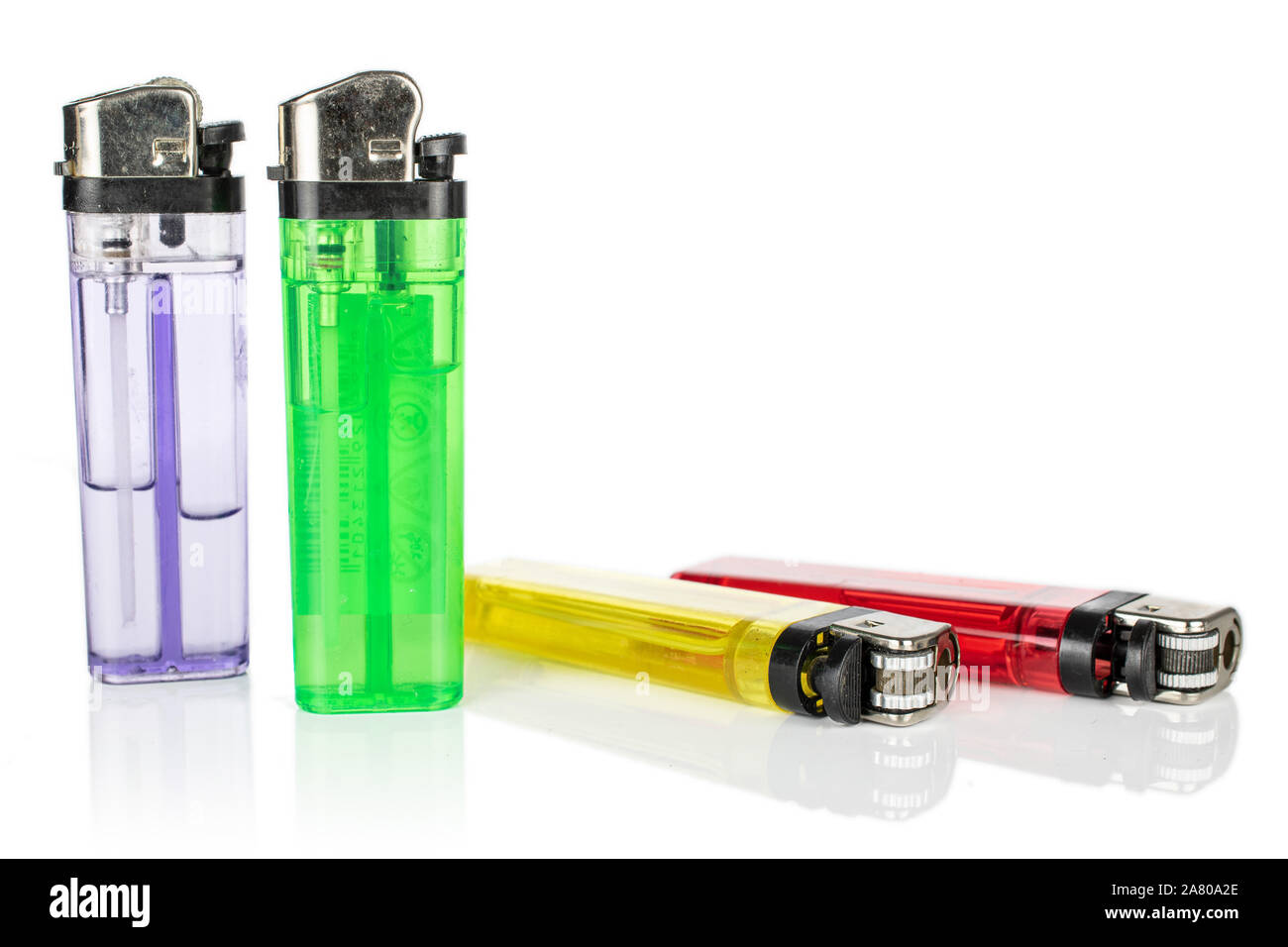 Group of four whole arranged plastic lighter isolated on white ...