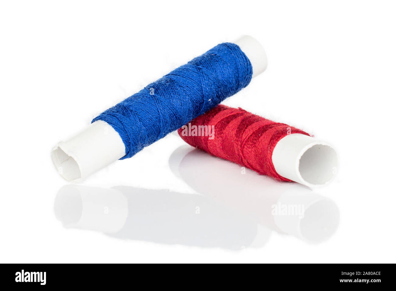 Group of two whole sewing thread spool isolated on white background ...